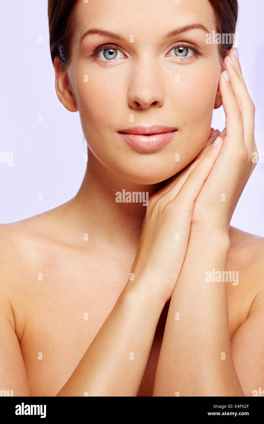 Gorgeous woman touching face hi-res stock photography and images - Alamy
