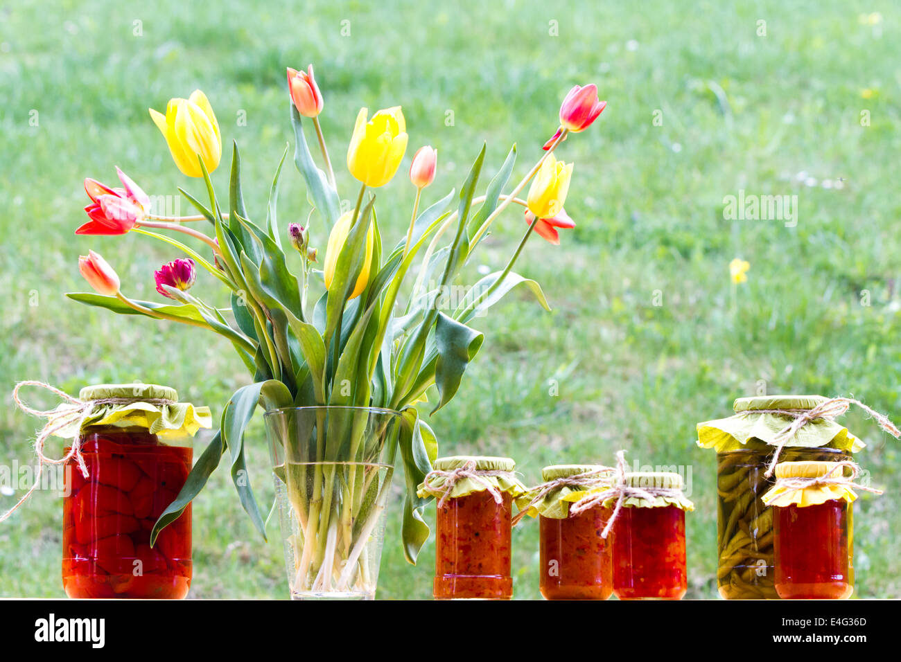 Rustic jars of eastern European homemade delicacies (orange marmalade ...