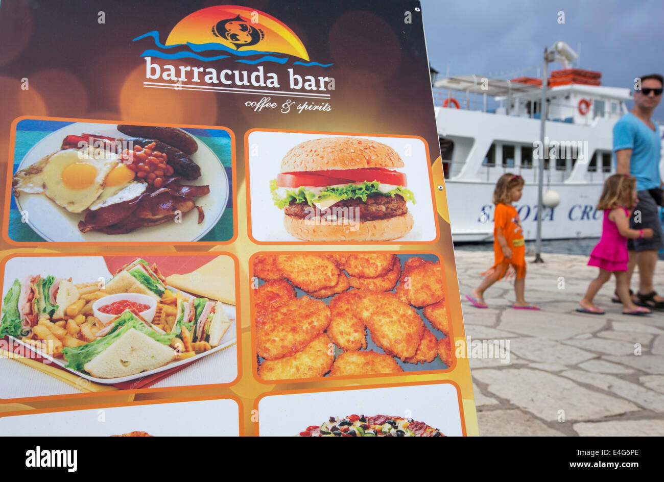 A menu board outside a seafront restaurant in Sivota, Greece Stock ...
