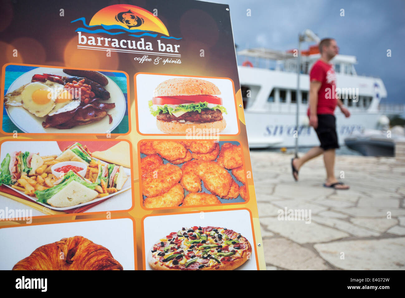 A menu board outside a seafront restaurant in Sivota, Greece Stock ...