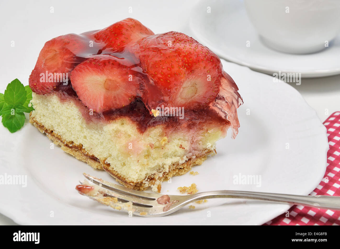 strawberry pie, missing bite on white plate, close up Stock Photo - Alamy