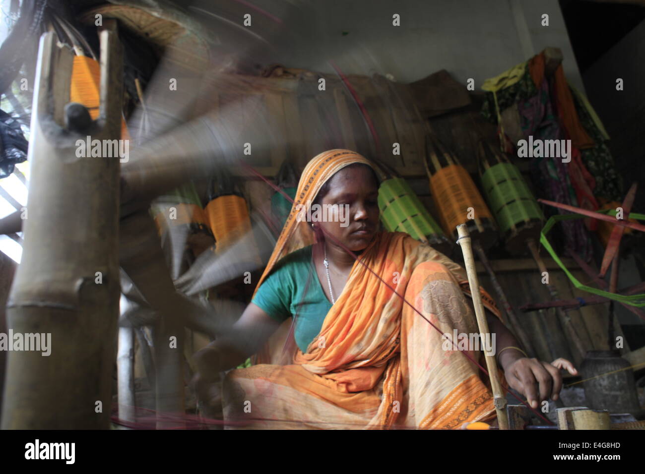 weaving fabrics for making jamdani sharee.A sharee is the traditional ...