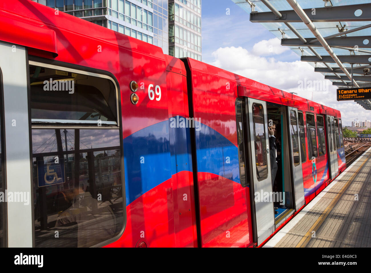 A Docklands Light Railway train (DLR) at a station near Canary wharf ...