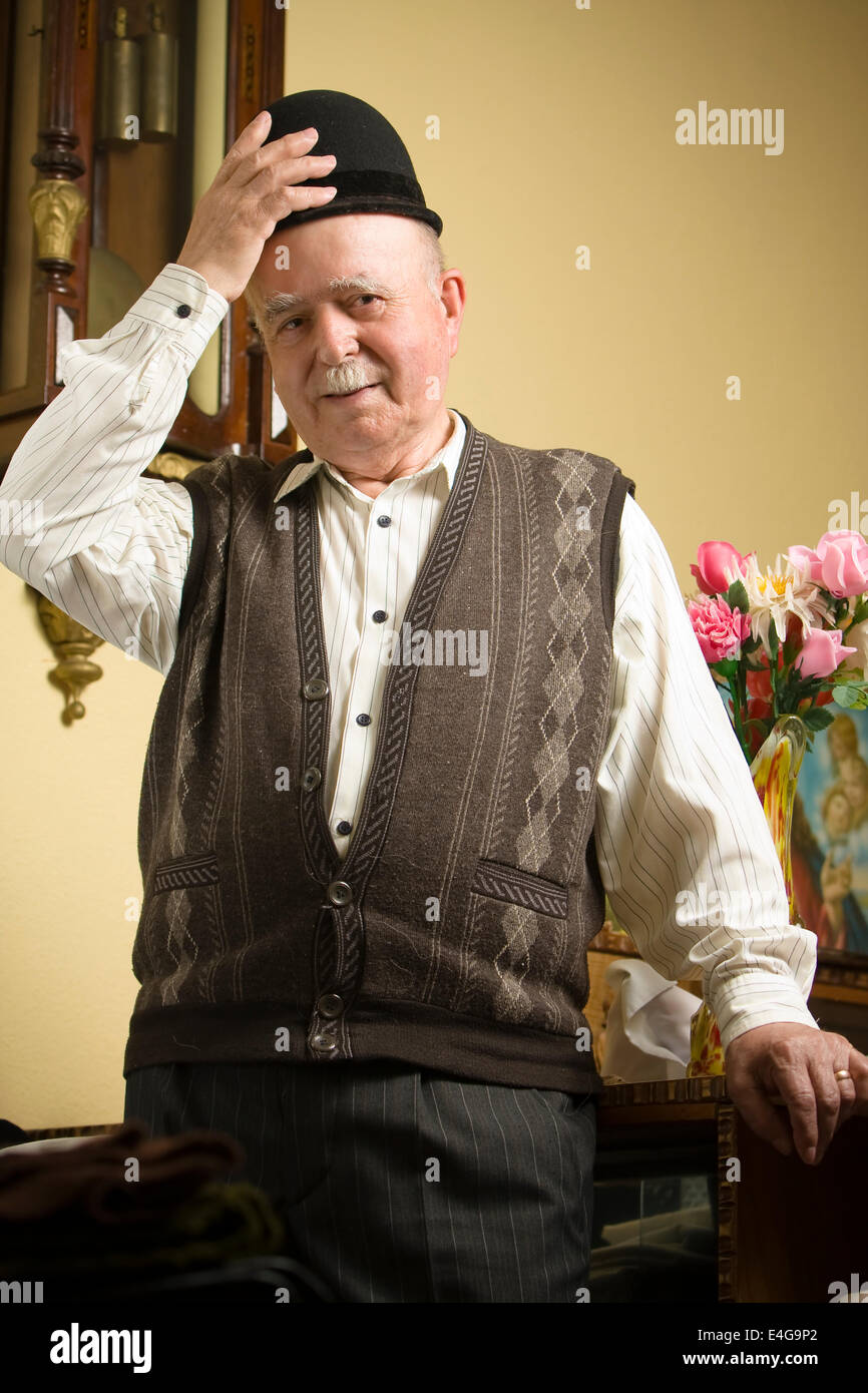 Old man taking his hat off Stock Photo - Alamy
