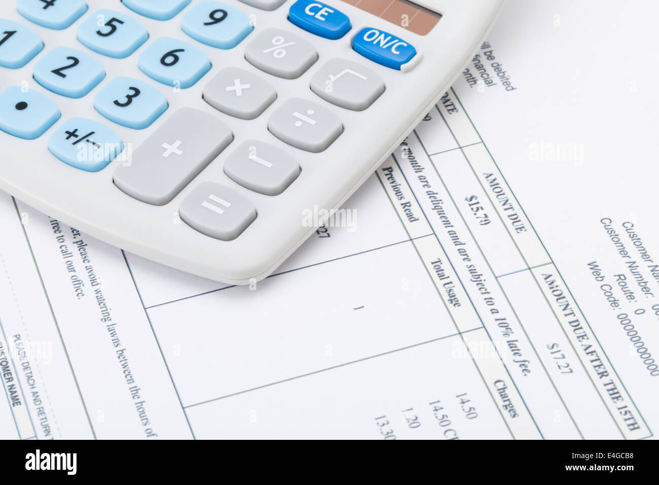 Studio shot of receipt next to calculator Stock Photo - Alamy
