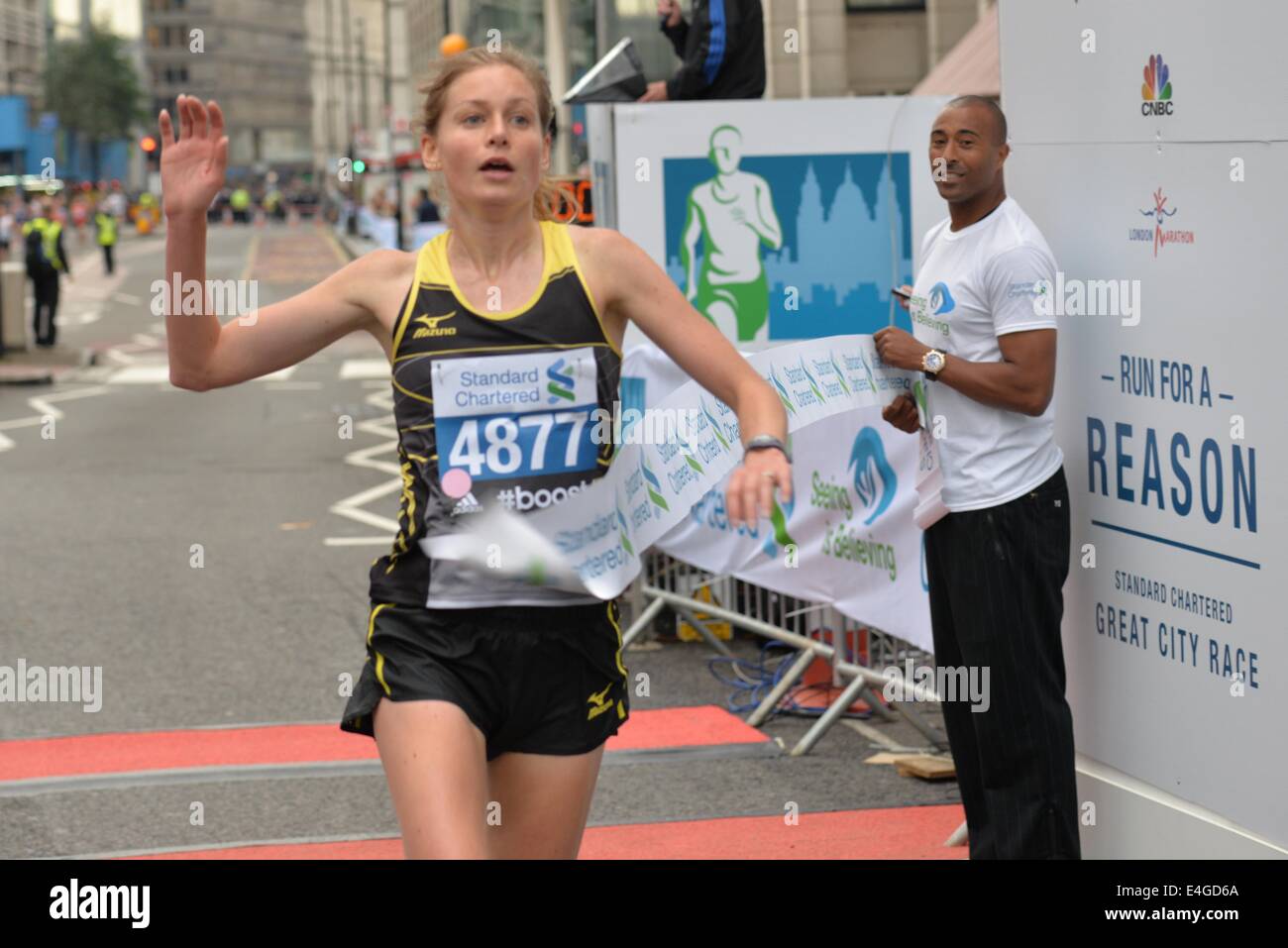 London, UK. 10th July, 2014. Emily Wicks is the first male runner at ...