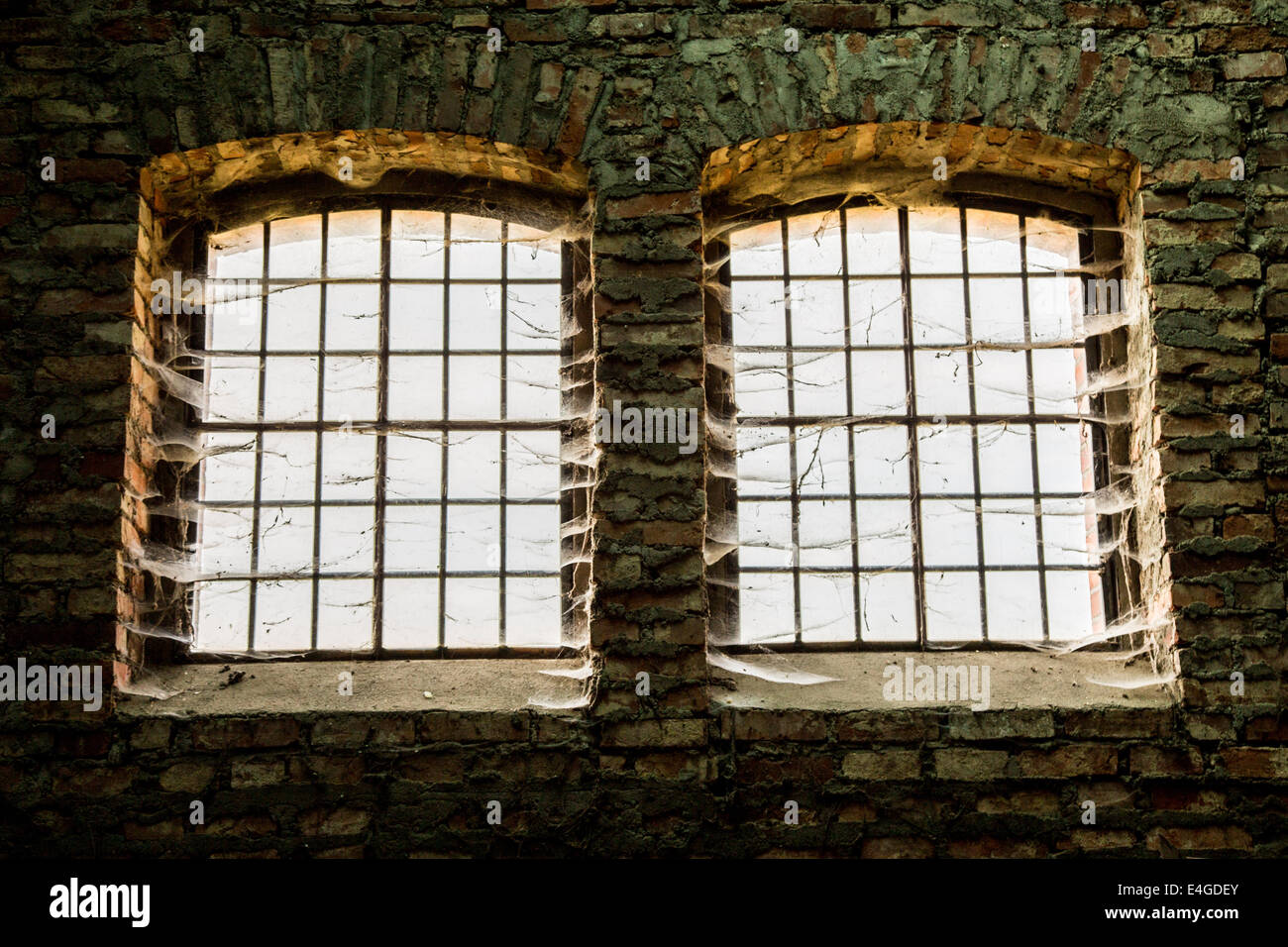 Old destroyed windows with old iron bars Stock Photo - Alamy