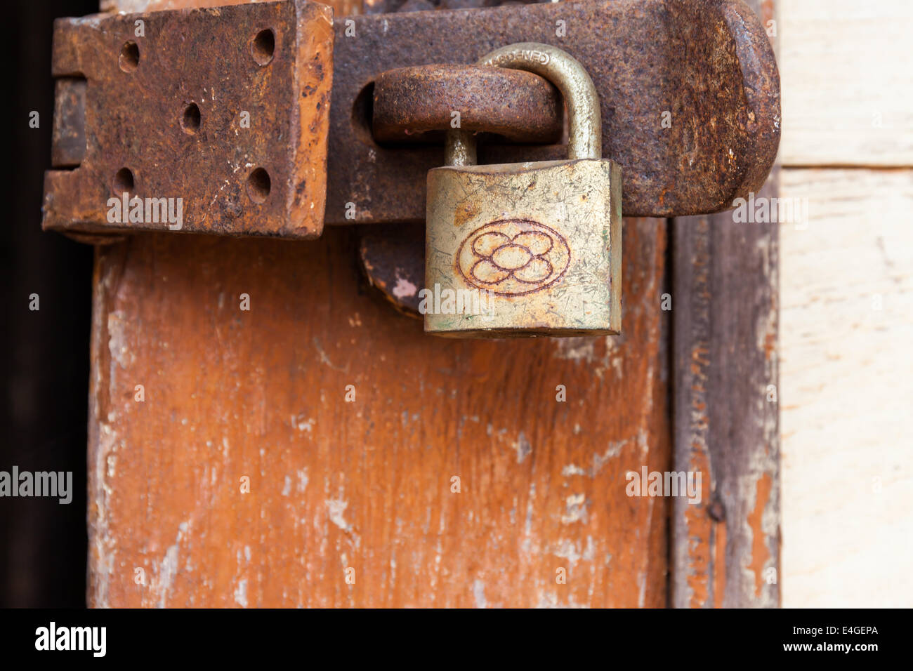 Old rusty padlock on a wooden door Stock Photo - Alamy