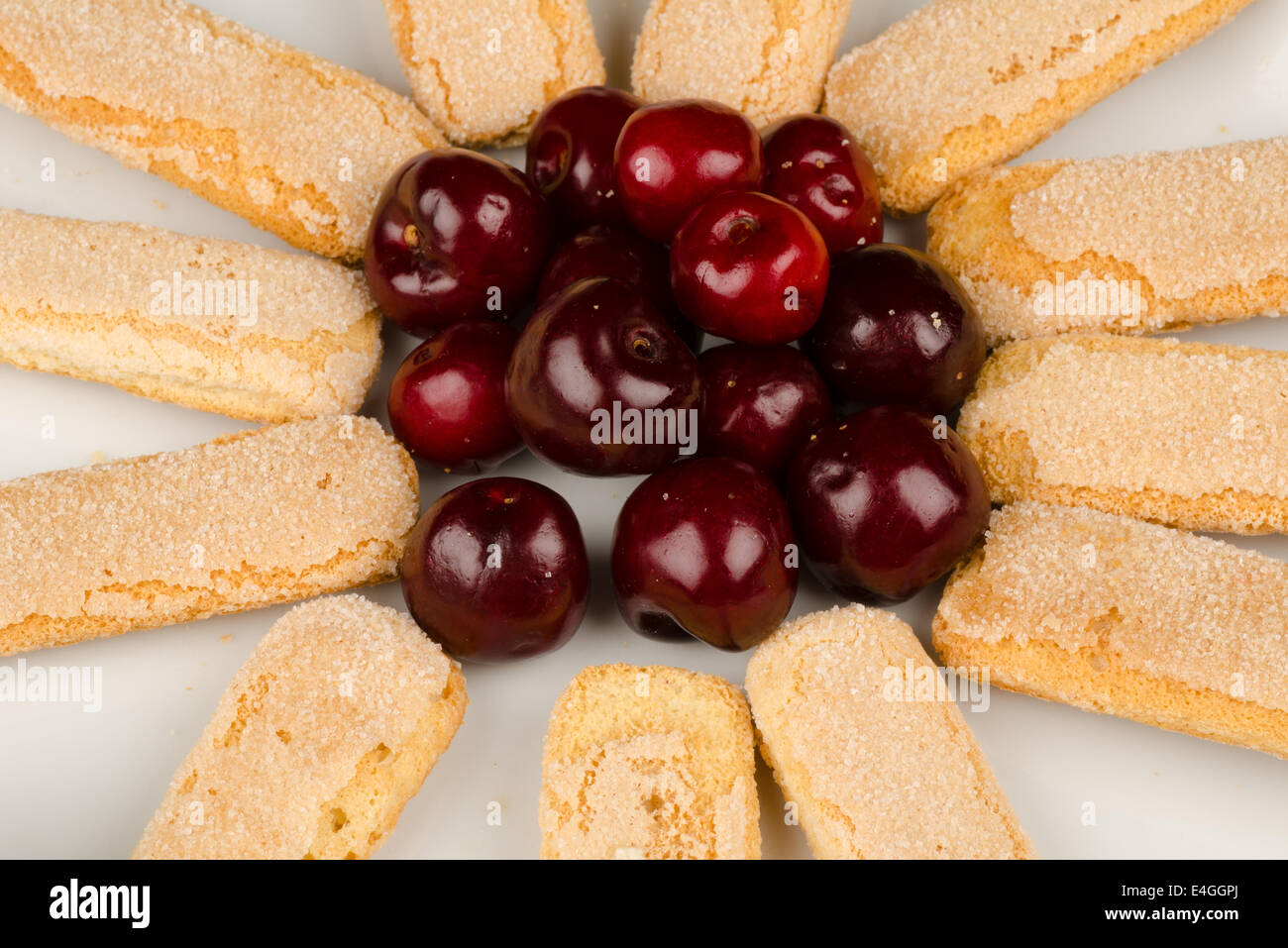 Cherries surrounded by biscuits in a flower shape, a kid dessert Stock ...