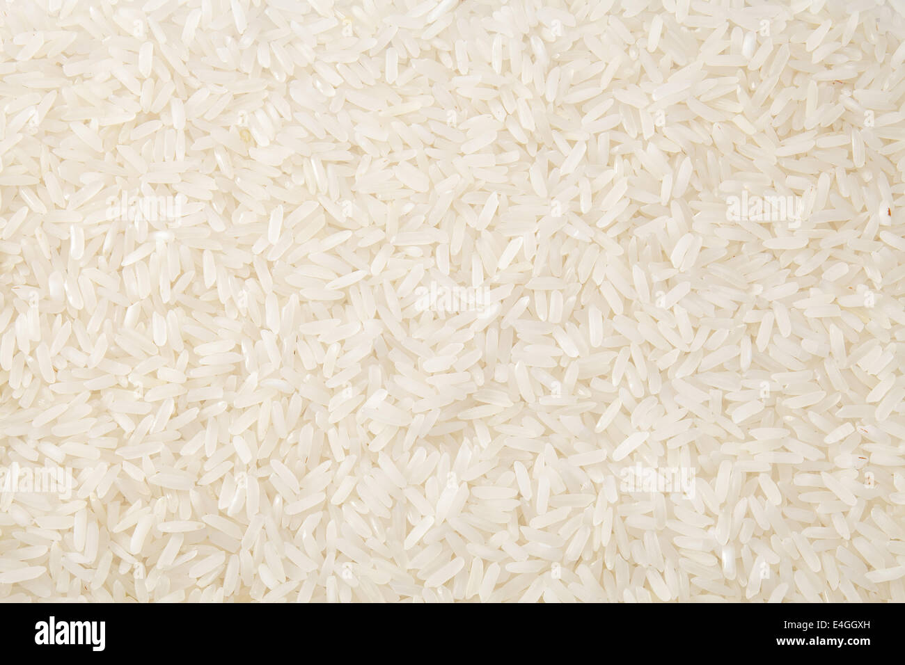 Jasmine Thai rice spread as background Stock Photo - Alamy