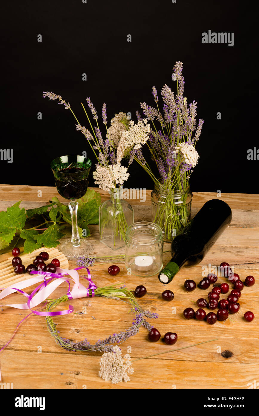Rustic table with an arrangement around a vine theme Stock Photo - Alamy