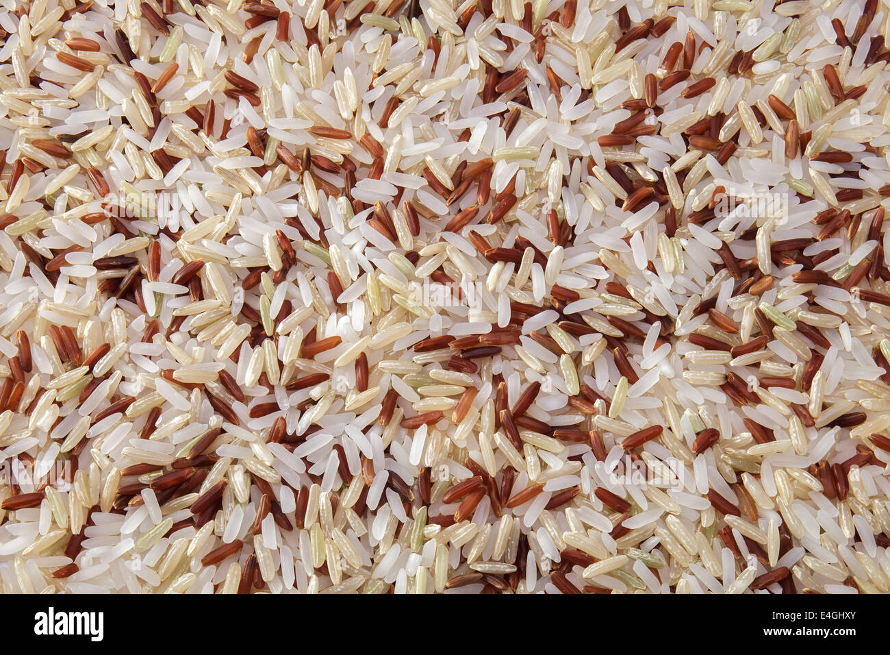 Thai organic brown rice spread as a background Stock Photo - Alamy