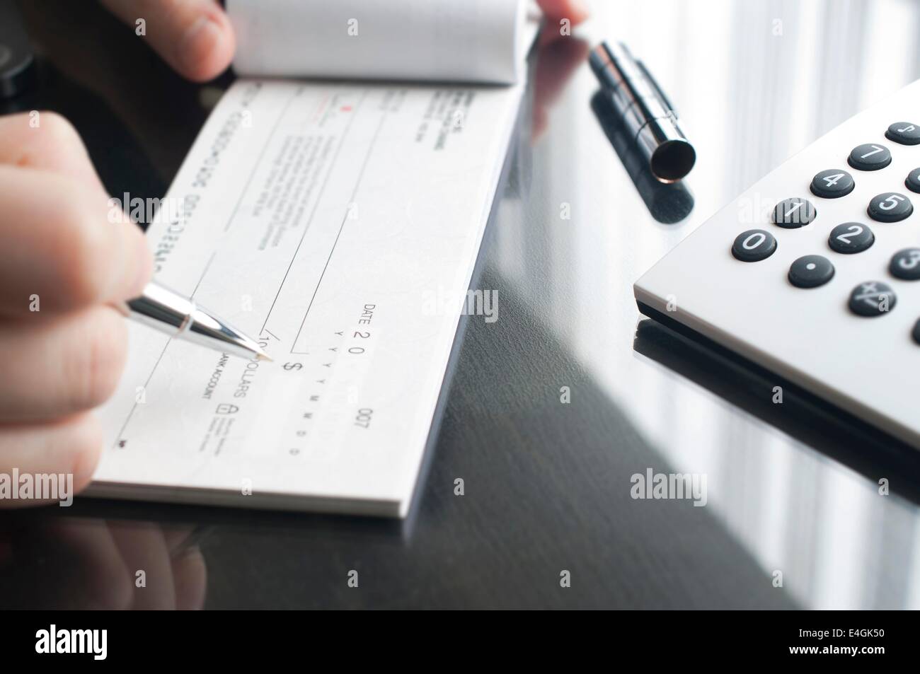 Business woman prepare writing a check Stock Photo - Alamy