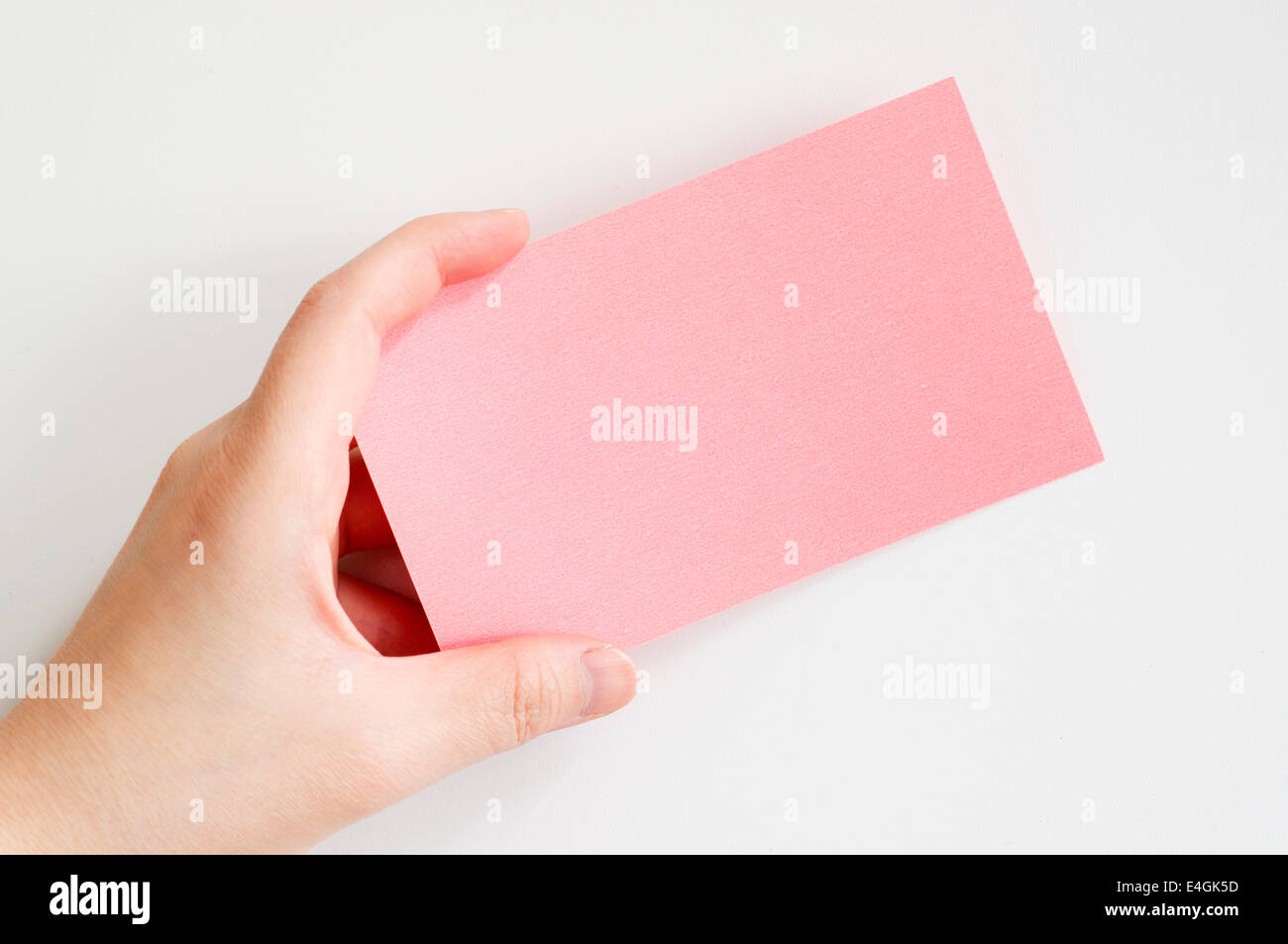 Girl holding paper white hi-res stock photography and images - Alamy