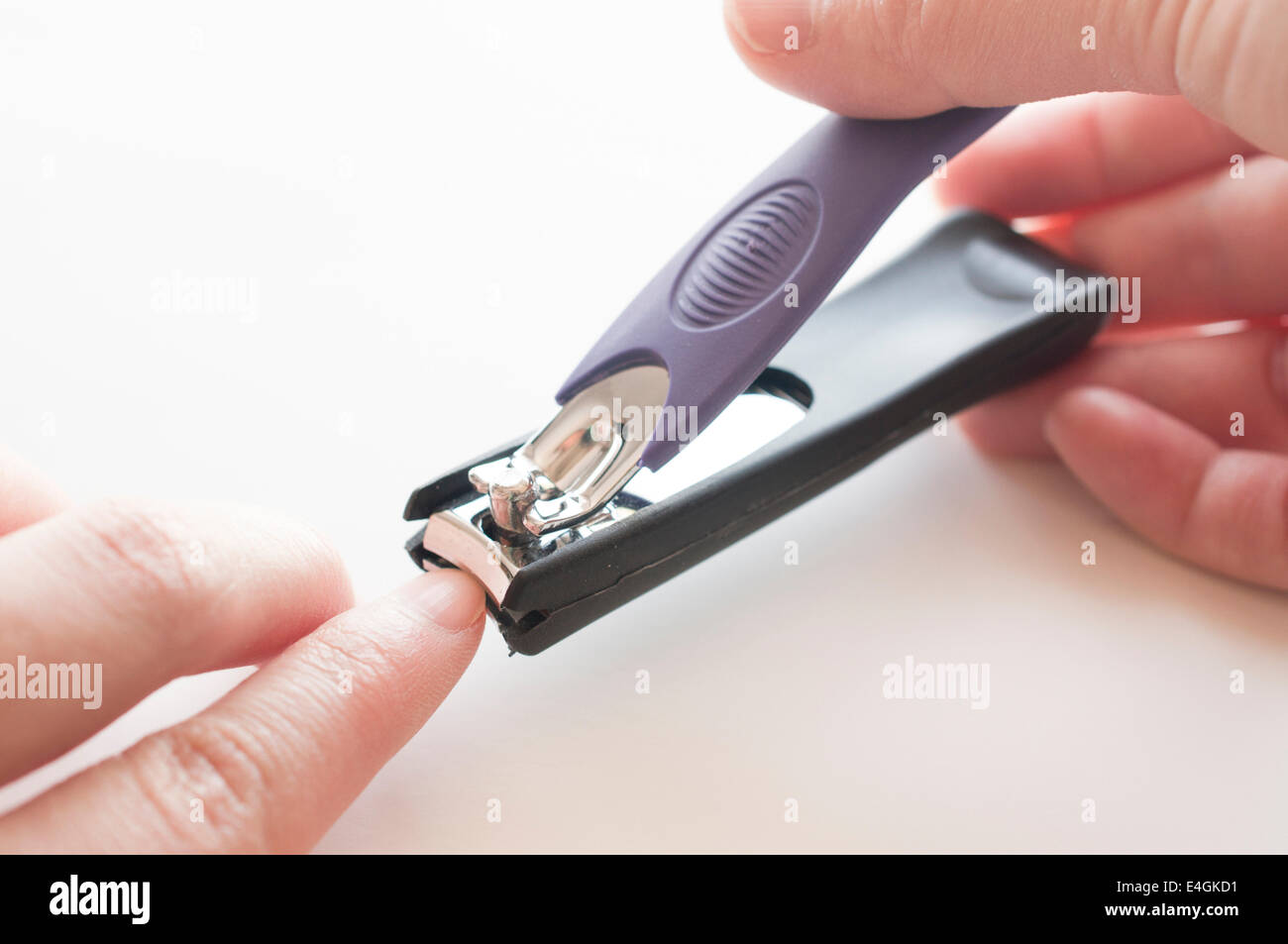 Hand manicure with nail clipper Stock Photo - Alamy
