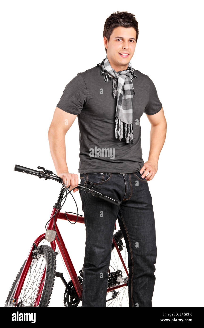 Fashionable young man standing by a bicycle Stock Photo - Alamy