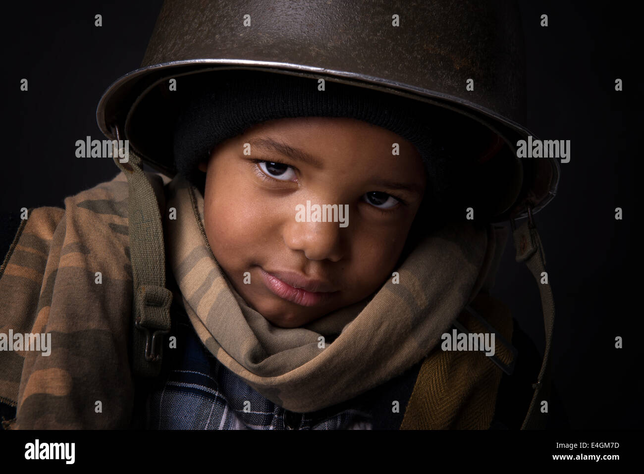 Young boy soldier portrait in a dark background Stock Photo - Alamy