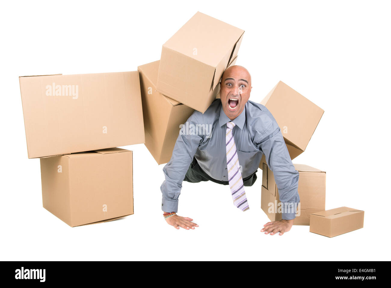 Stressed businessman under a pile of cardboard boxes Stock Photo - Alamy