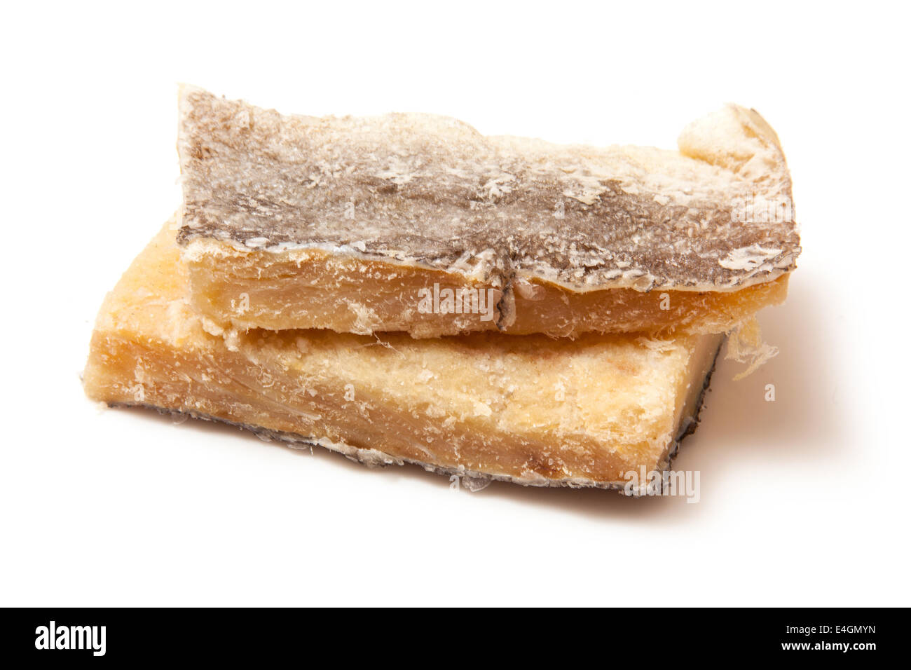 Pieces of salt cod fish isolated on a white studio background Stock ...