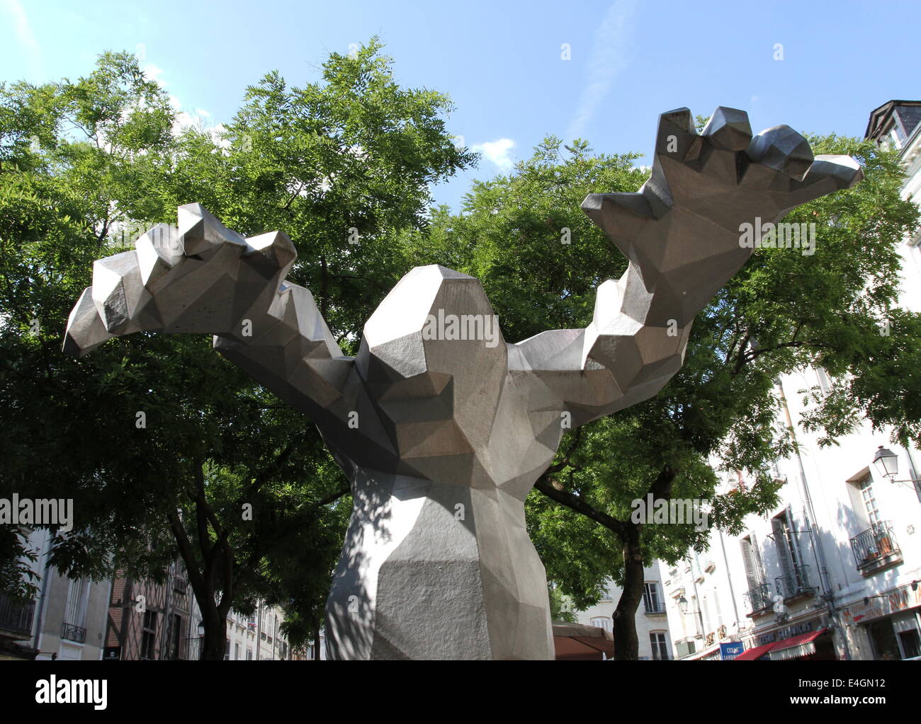 Large metal statue with outstretched arms Tours France July 2014 Stock ...
