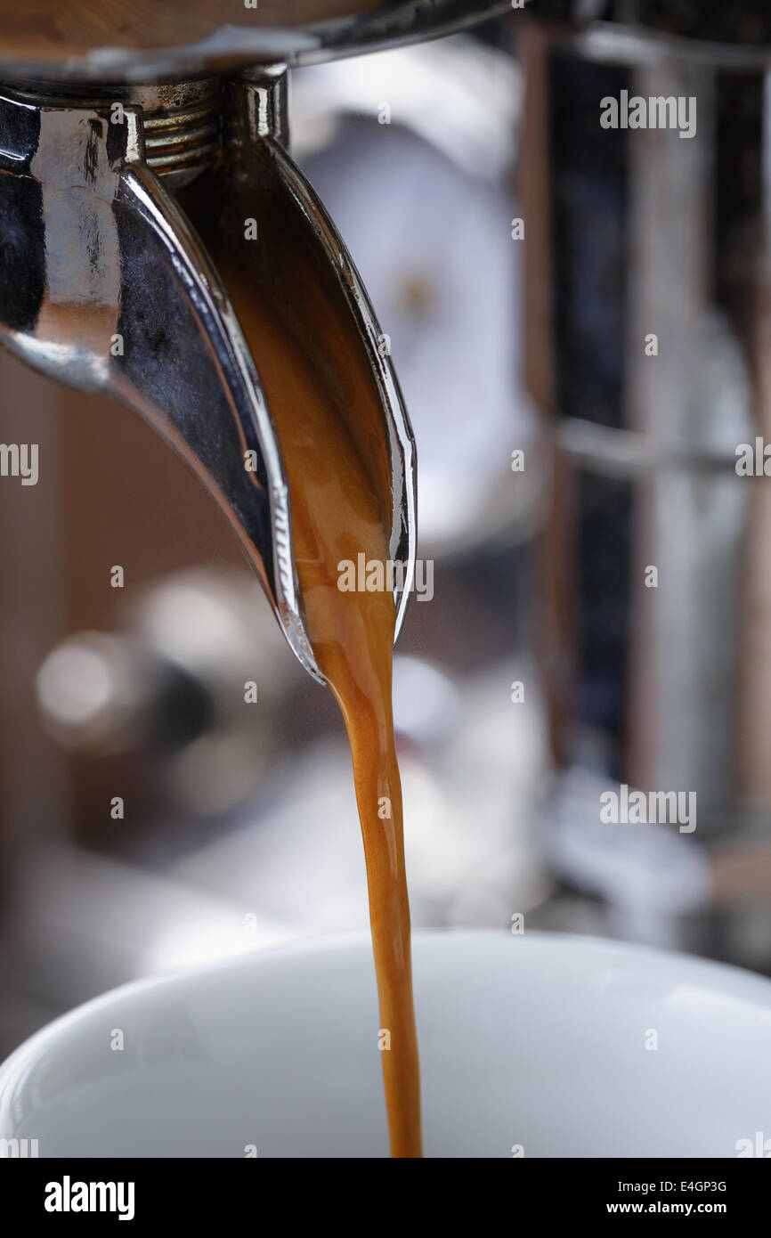 pouring simple espresso with coffee machine, close up Stock Photo - Alamy