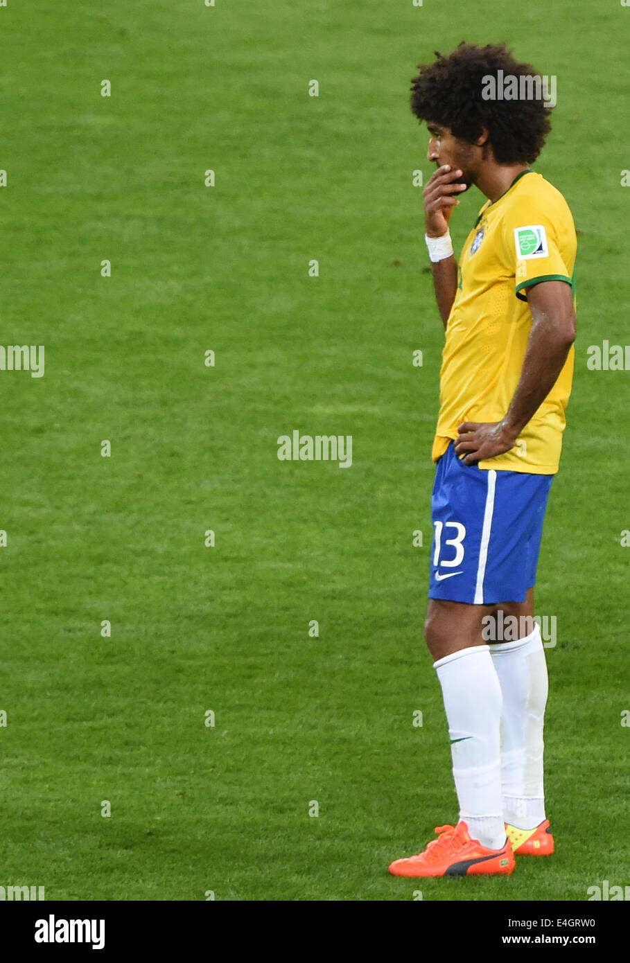 Brazil's Dante stands on the pitch during the FIFA World Cup 2014 semi ...