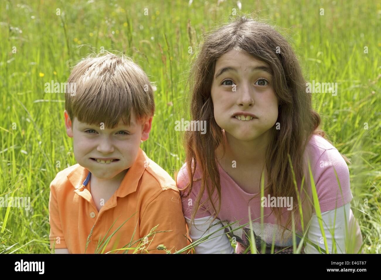 two children making grimaces Stock Photo - Alamy