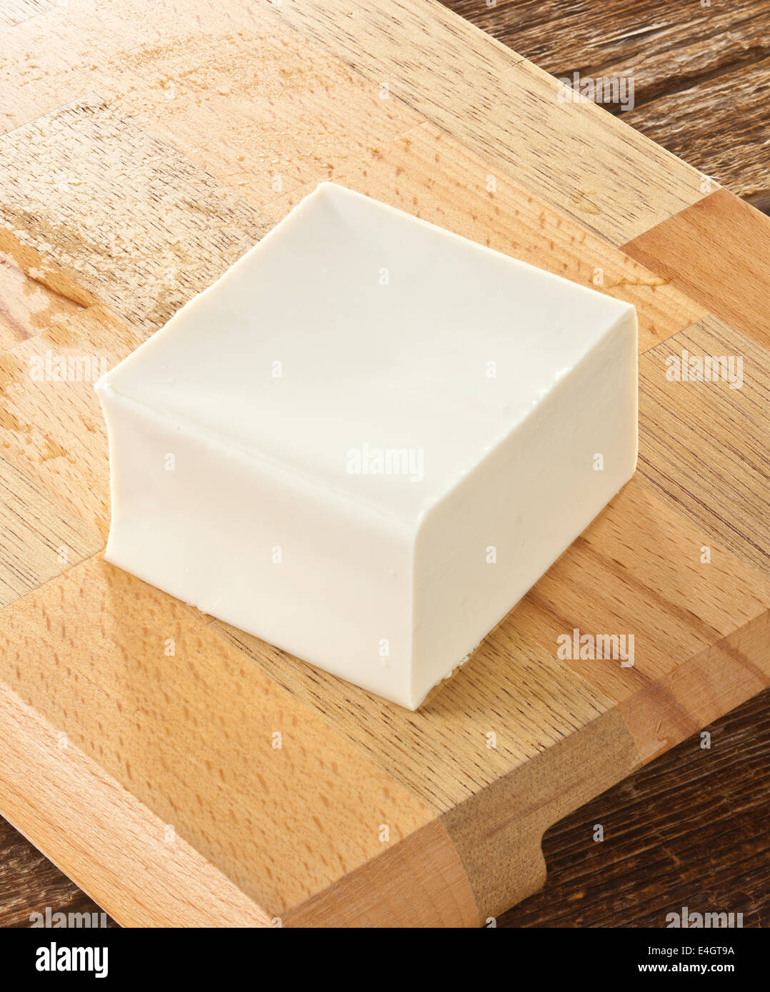 Fresh Tofu cubes on wooden cutting board Stock Photo - Alamy
