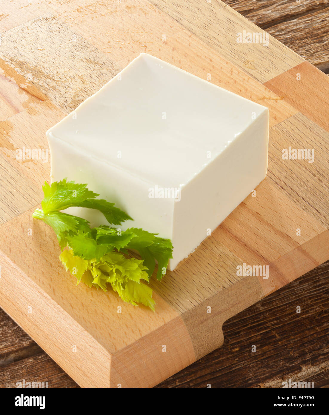 Fresh Tofu cube on wooden cutting board Stock Photo - Alamy