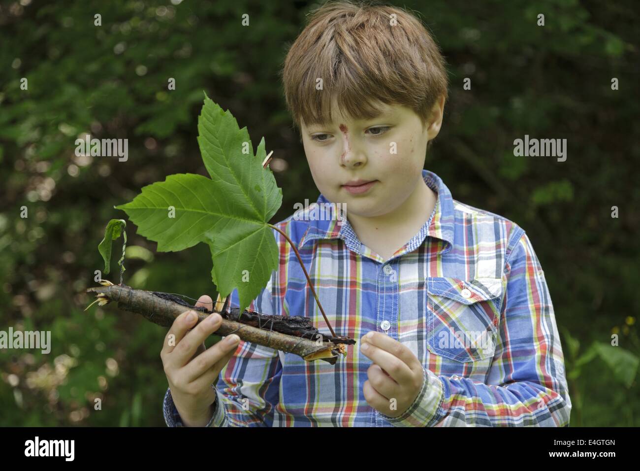 boy with self-made boat Stock Photo - Alamy