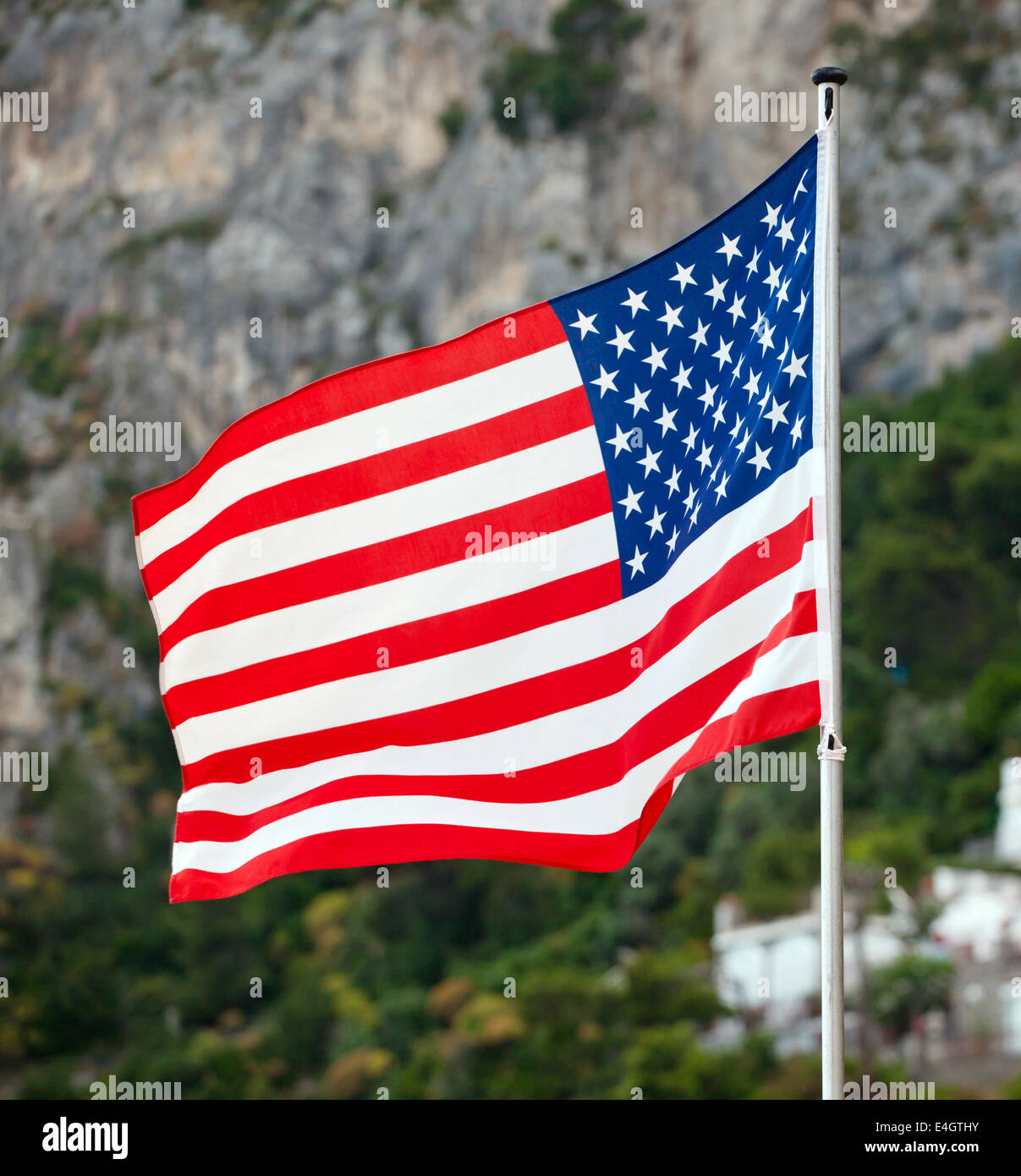 American flag over natural scenery with mountains and trees Stock Photo ...
