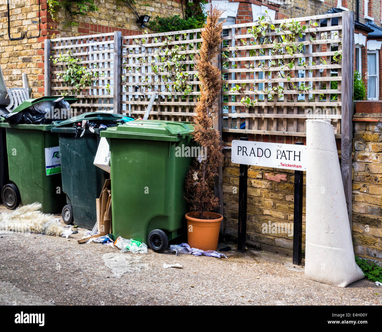 Funny sign - Prado path sign next to trash bins and discarded objects ...