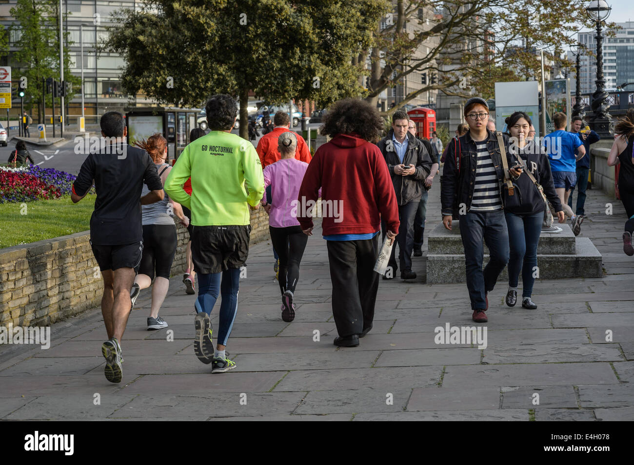 Commuters running home from work along a South Bank promenade on the ...