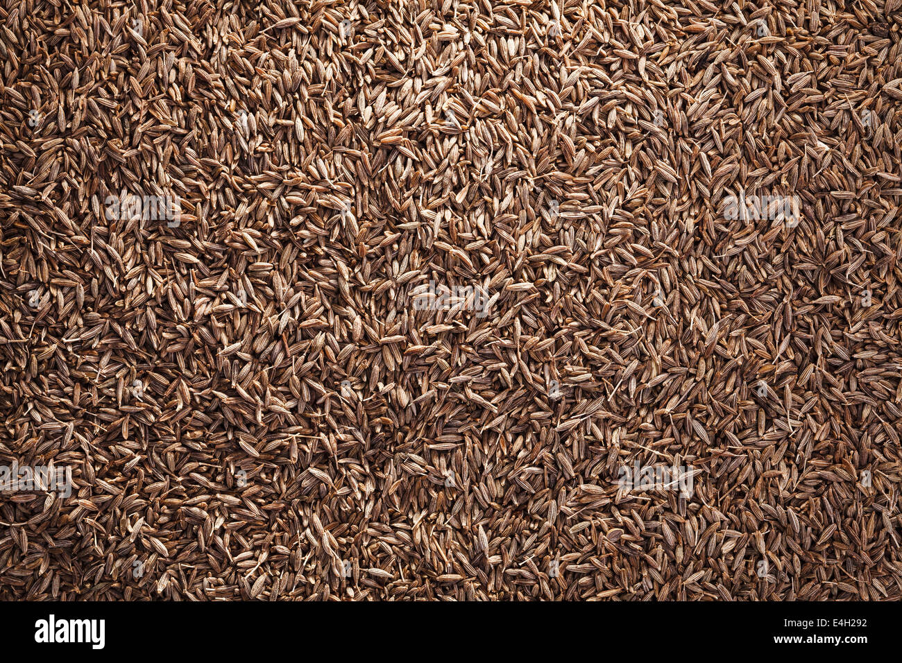 Heap of cumin seeds arrange as background Stock Photo - Alamy