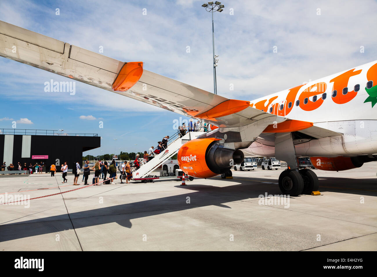 Passengers boarding via front stairs to Easyjet plane Stock Photo - Alamy