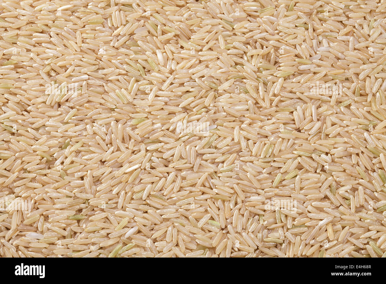 Thai organic brown rice spread as a background Stock Photo - Alamy