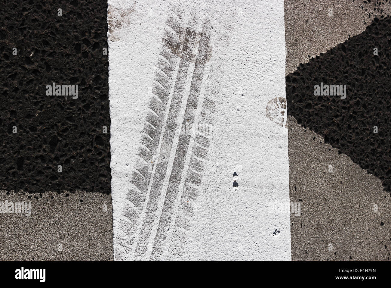 The tire's footprint on fresh road markings Stock Photo - Alamy