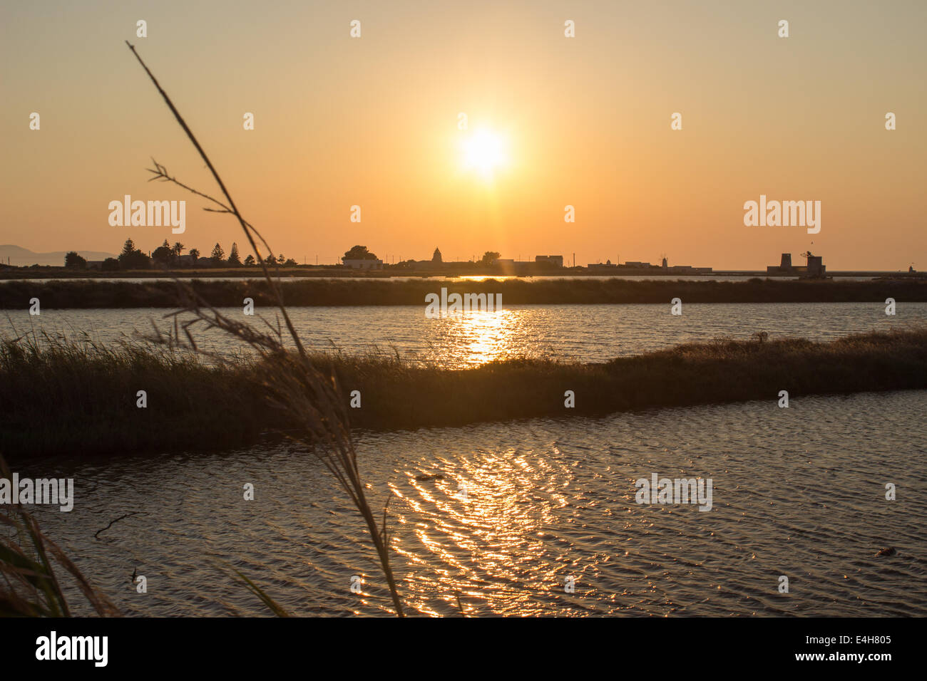 sunset sun salt-marsh water dusk orange evening landscape nobody ...