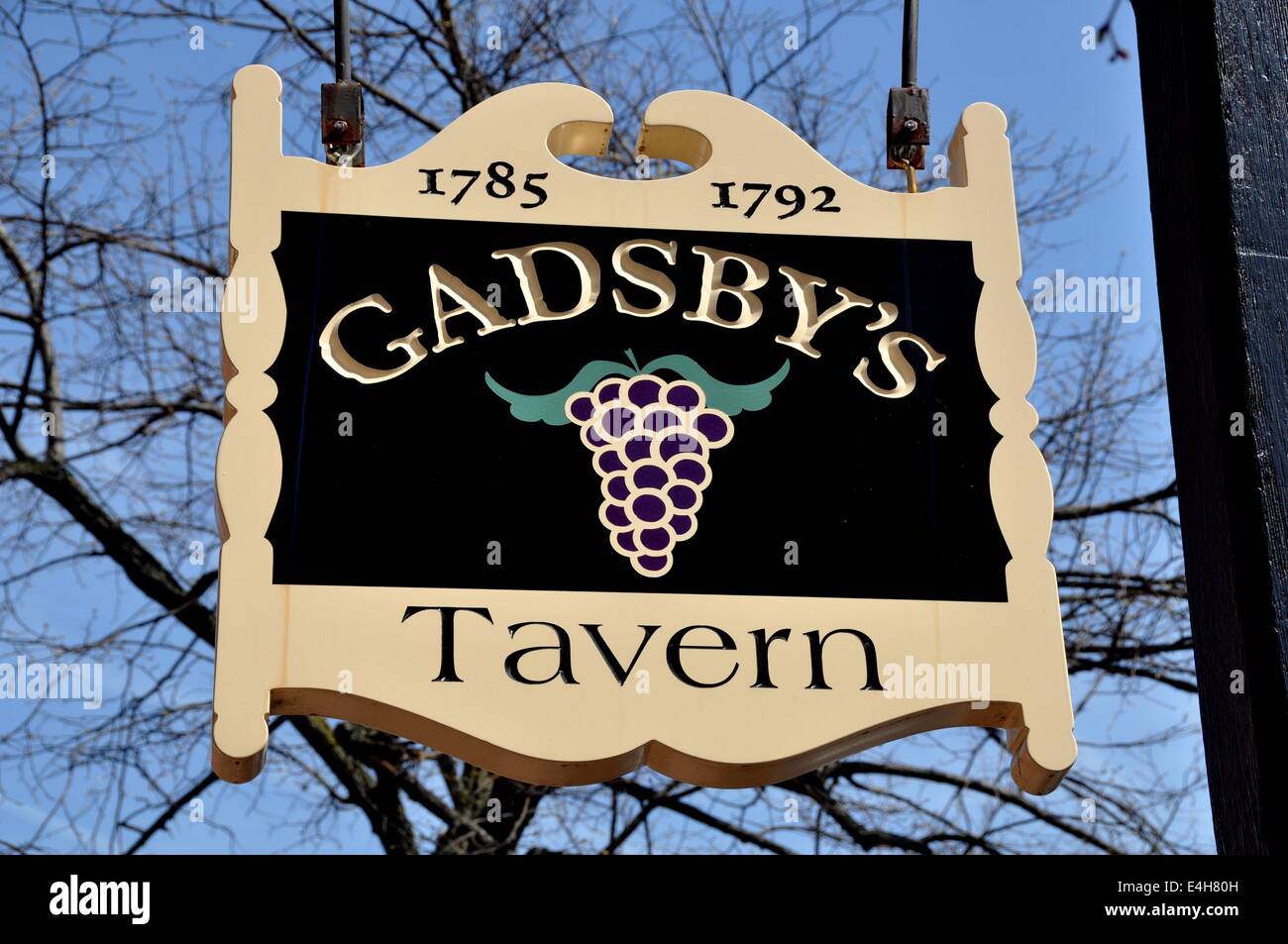 Alexandria, Virginia: Sign painted with a bunch of grapes hangs in ...