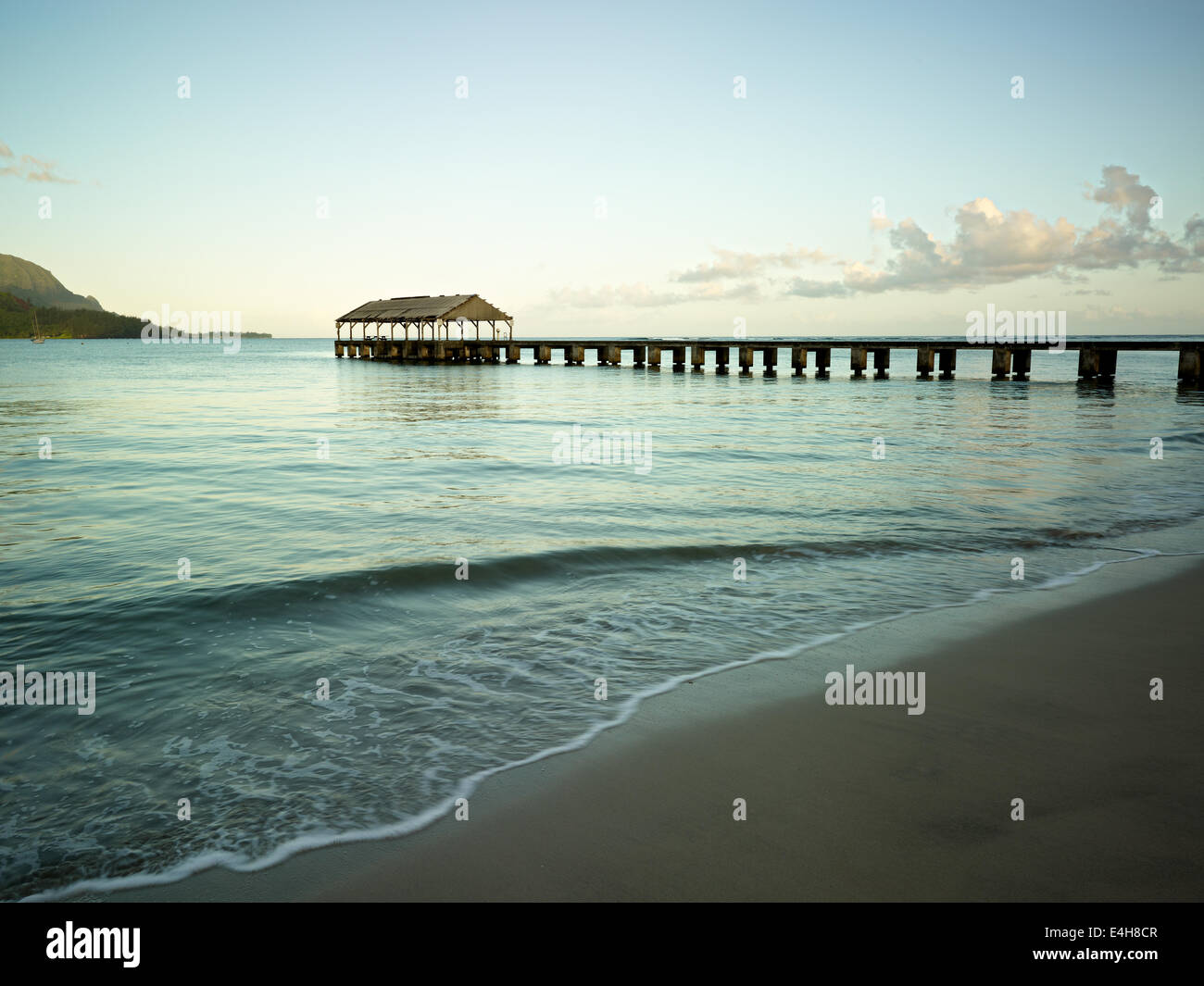 Hawaiian beach with concrete dock Stock Photo - Alamy