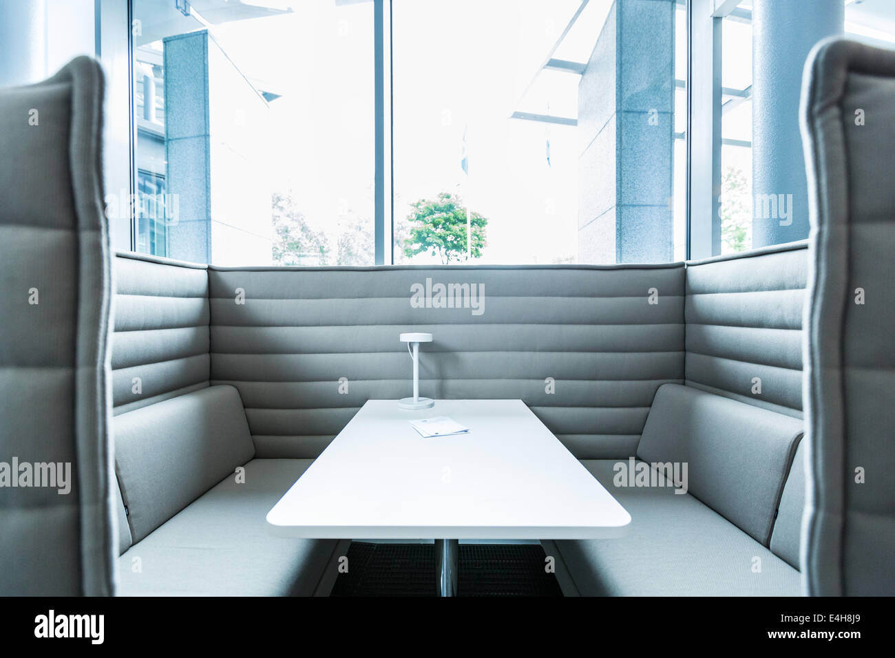 Padded booth in office space Stock Photo - Alamy