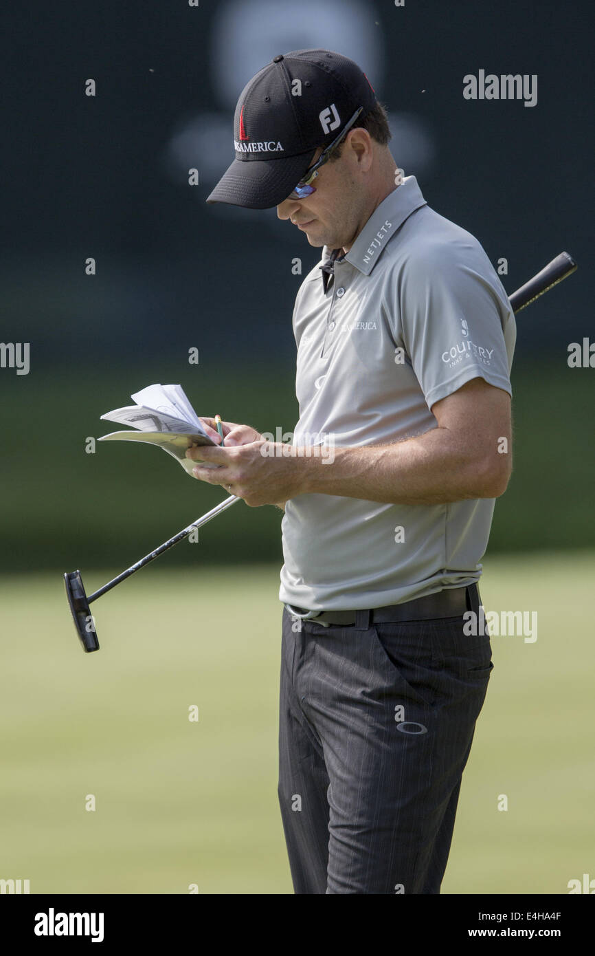 Silvis, Iowa, USA. 11th July, 2014. Zach Johnson, looks over his notes ...