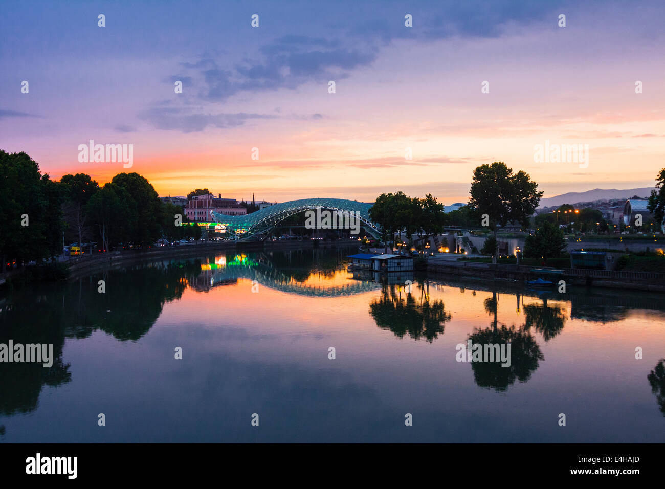Peace Bridge and Mtkvari river at sunset. Tbilisi, Georgia Stock Photo ...