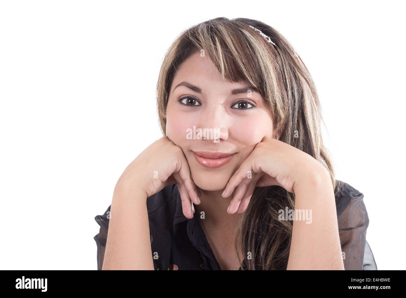 pretty girl posing with hands on her cheeks Stock Photo - Alamy