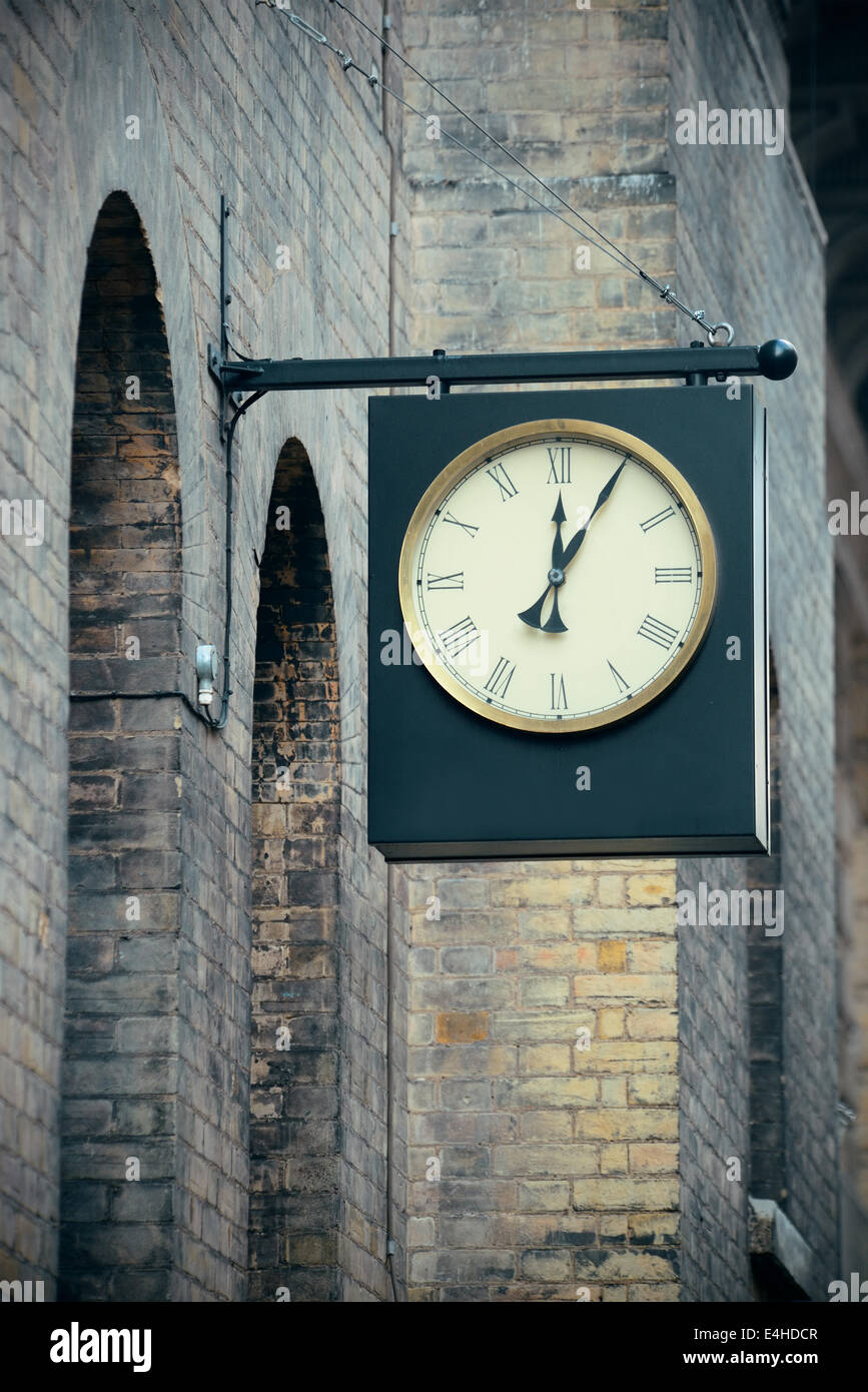 Urban historical architecture with vintage clock in street in London ...