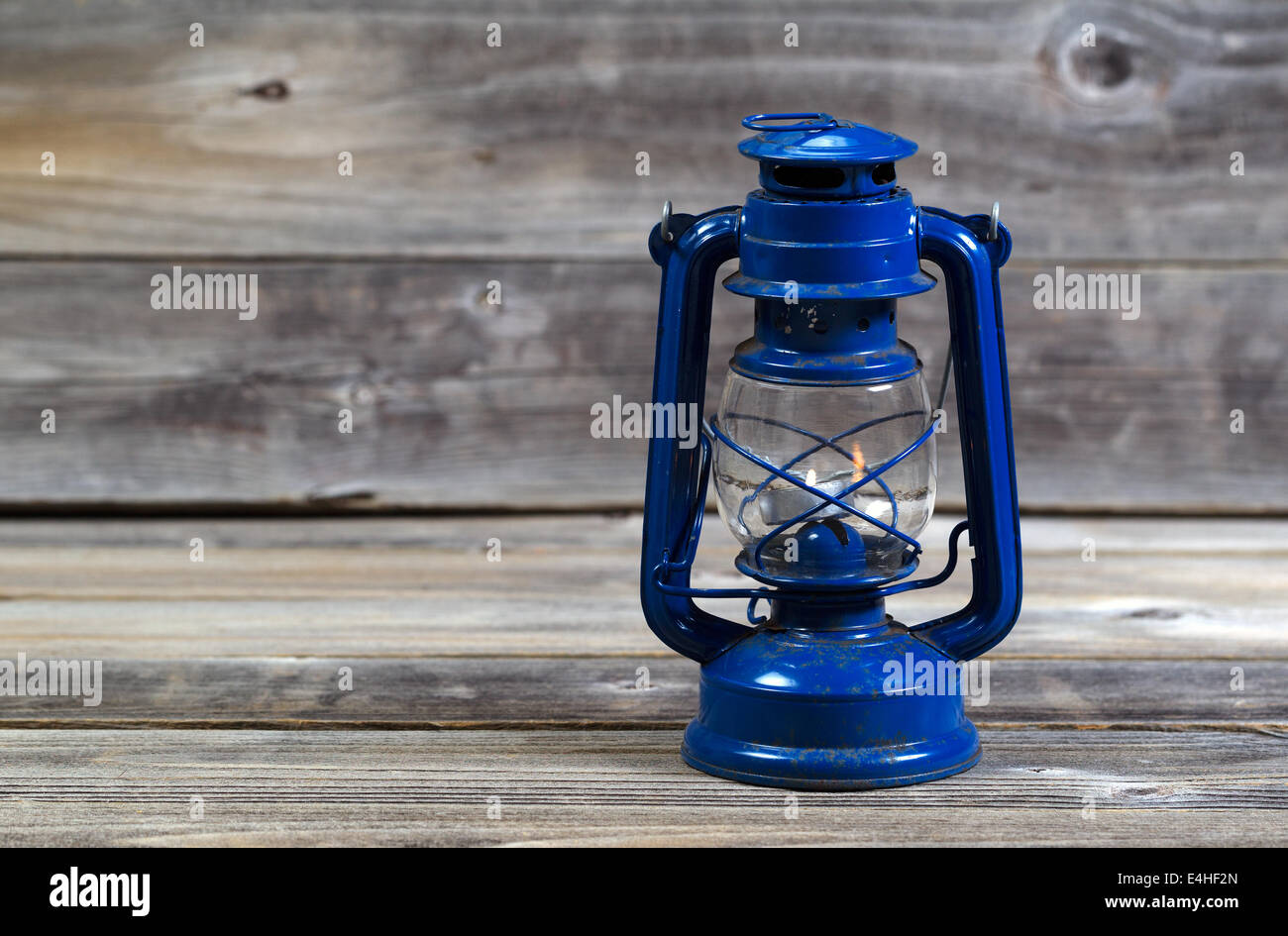 Front view of an old lantern restored and placed on rustic wood Stock ...