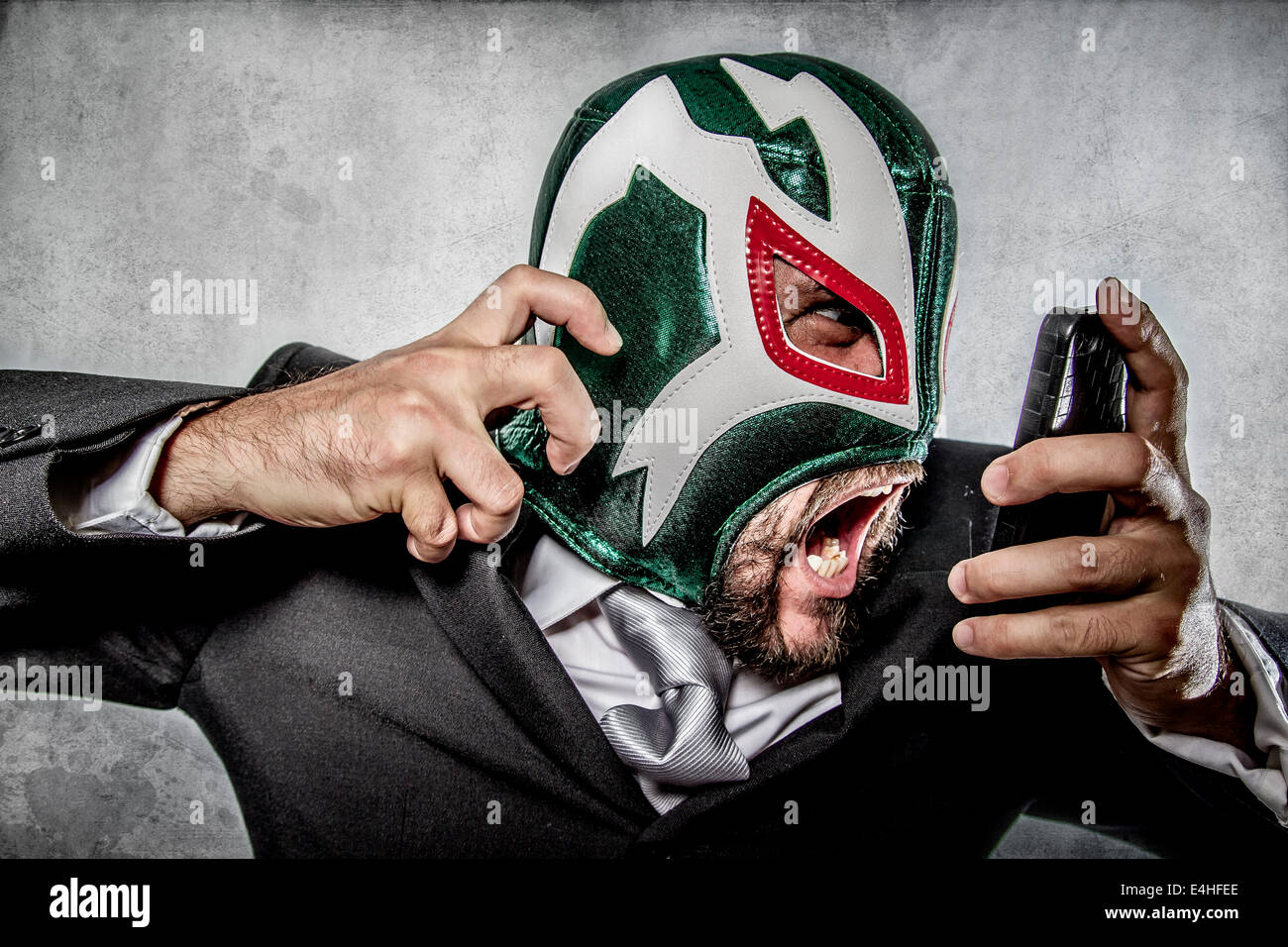 aggressive executive suit and tie, Mexican wrestler mask Stock Photo ...