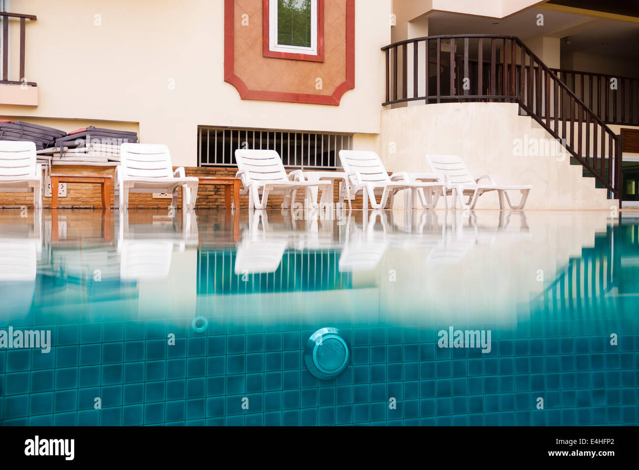 Swimming pool view from both above and under water simultaneously near ...