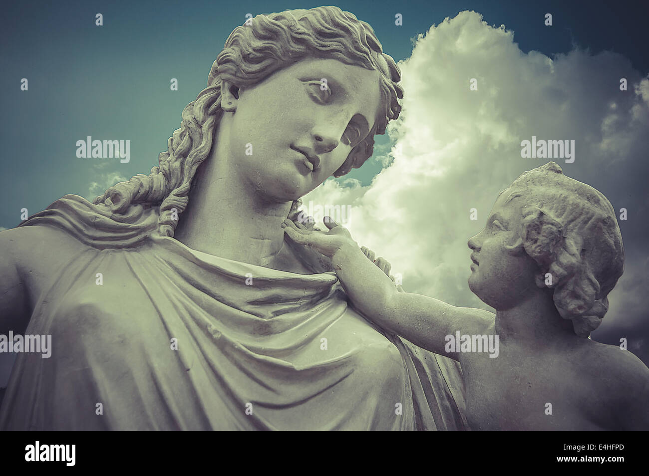 Woman and child Greek sculptures over clouds background Stock Photo - Alamy