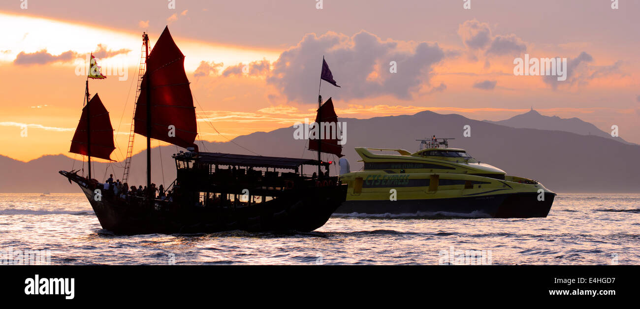 Traditional Chinese junk and the Yellow Macau turbo jet ferry, Victoria ...